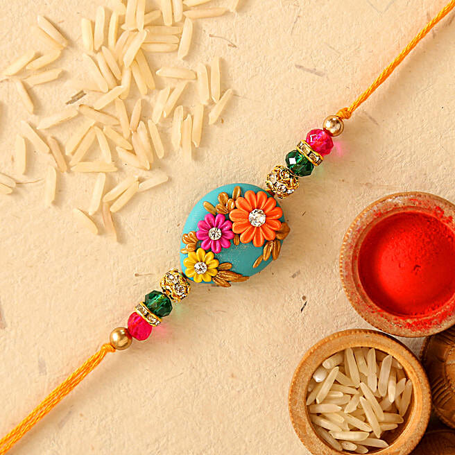 Blue Oval Shaped Floral Design Rakhi For Kids australia | Gift Blue ...