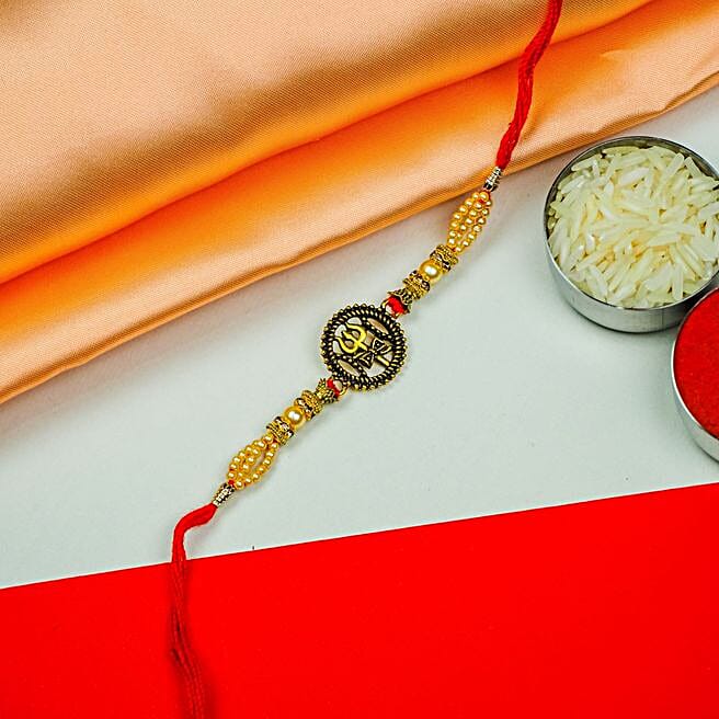 Devotional Trishul Rakhi australia | Gift Devotional Trishul Rakhi- FNP
