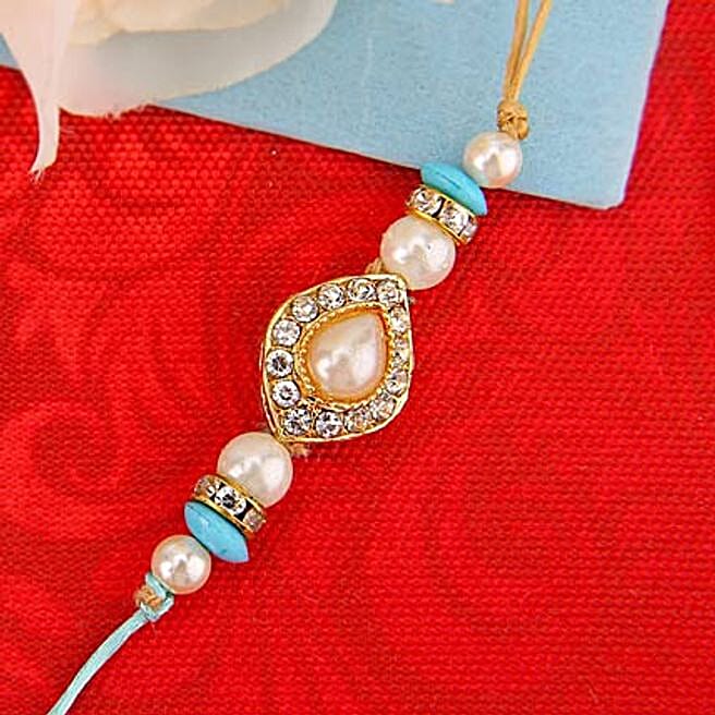 Buy/Send Pearly White Rakhi Online- FNP