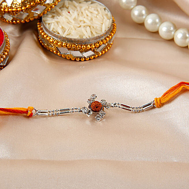 Buy/Send Silver Stone And Swastik Rakhi Online- FNP