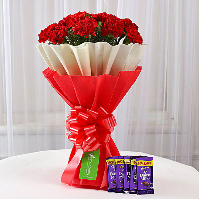 Buy/Send 12 Red Carnations Bouquet & Cadbury Dairy Milk Online- FNP