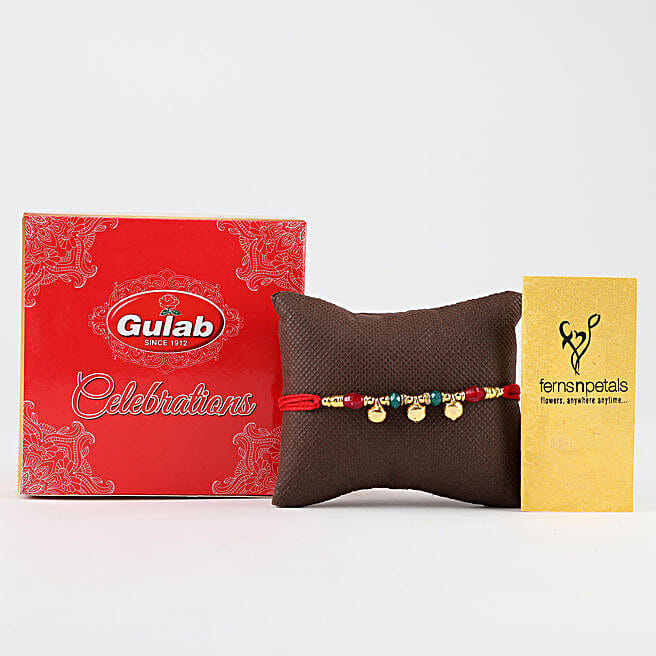 Buy/Send Kaju Katli & Designer Bells Rakhi Online- FNP