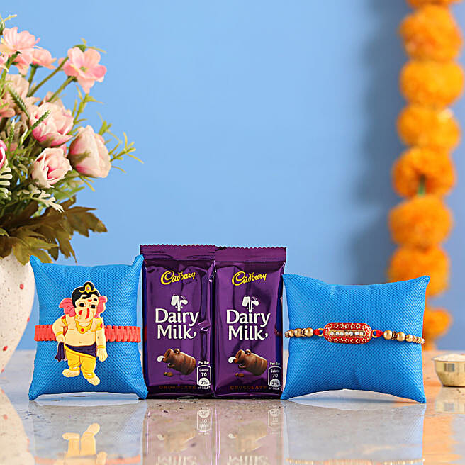 Buy/Send Capsule & Bal Ganesha Rakhis With Dairy Milk Online- FNP