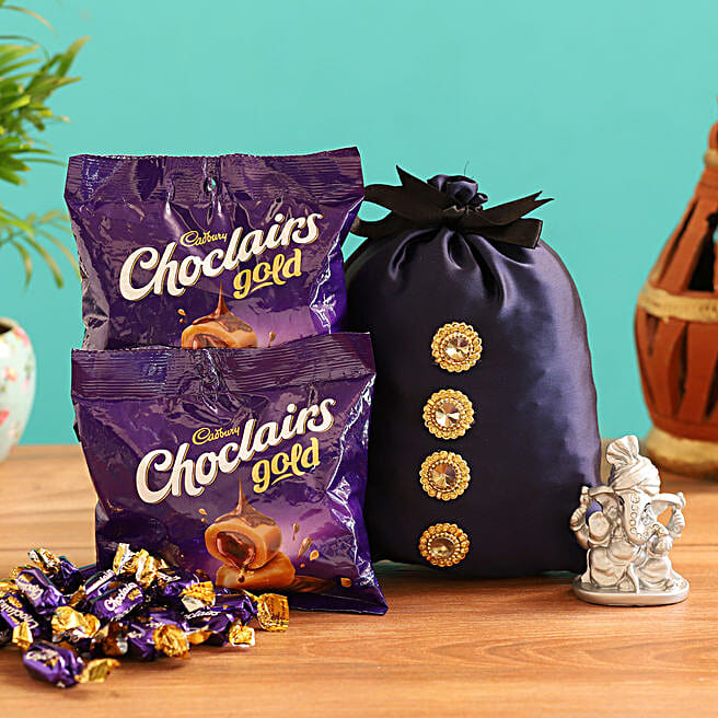 Buy/Send Silver Ganesha Idol & Choclairs In Purple Potli Online- FNP