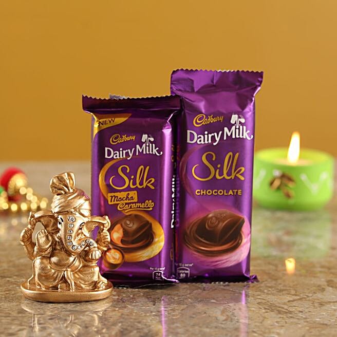 Buy/Send Dairy Milk Duo & Golden Ganesha Idol Online- FNP