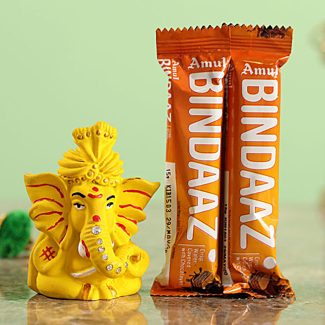 Buy/Send Bindaaz Wafer Choco Bars & Matte Yellow Ganesha Idol Combo Online- FNP