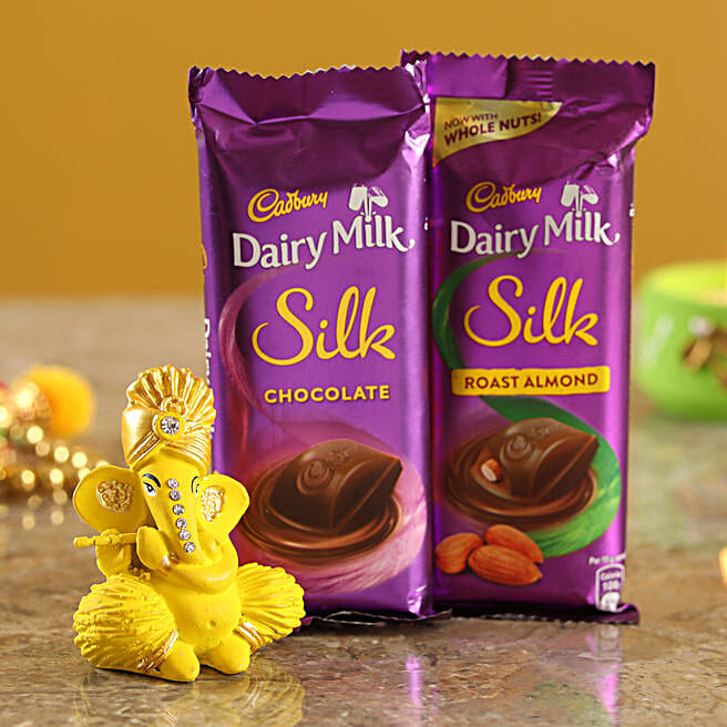 Buy/Send Dairy Milk Silk Chocolates & Yellow Ganesha Idol Combo Online- FNP