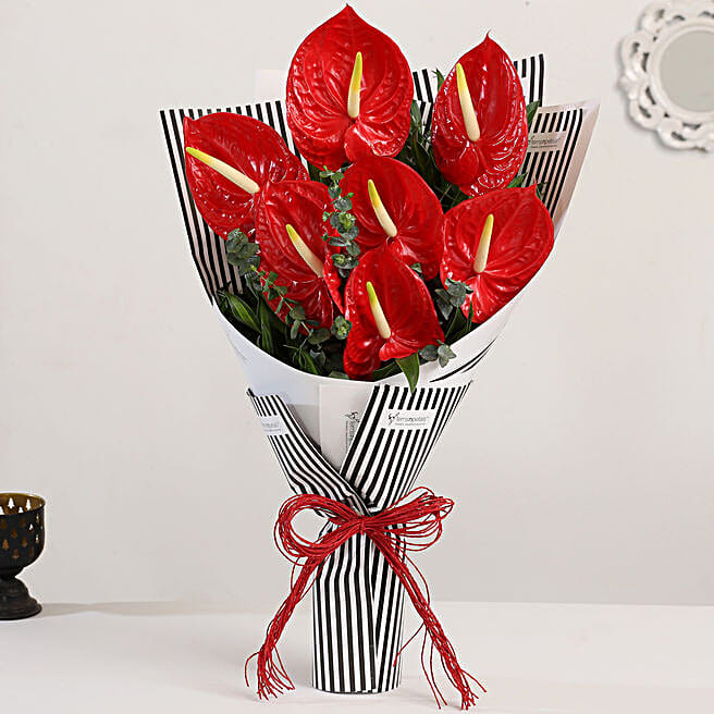 Buy/Send 7 Red Anthuriums Black & White Bouquet Online- FNP