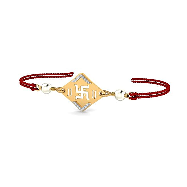 Buy/Send 18K Gold Swastika Rakhi Online- FNP