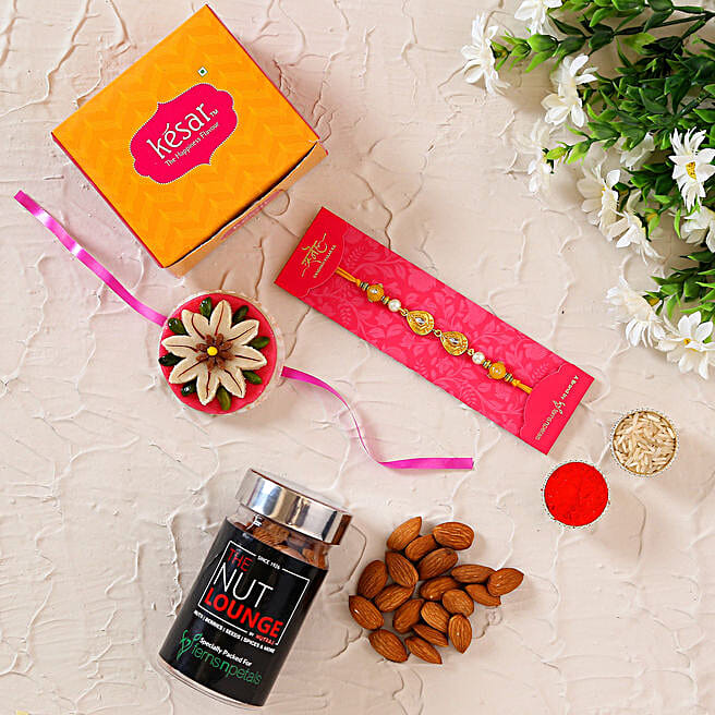 Buy/Send Kundan Rakhi and Edible Kesar Mithai Rakhi With Almonds Online ...