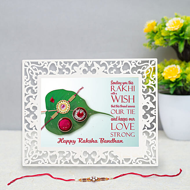 Buy/Send Traditional Rakhi and Carved Floral Frame Online- FNP