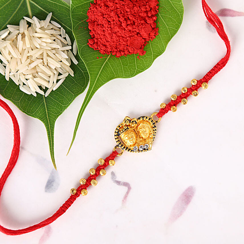 Buy/Send Sneh Holy Radha Krishna Rakhi Online- FNP Buy/Send Sneh Holy Radha Krishna Rakhi Online- FNP