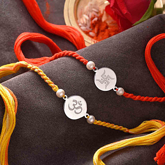 Buy/Send Holy Om & Swastik Silver Rakhi Set Online- FNP