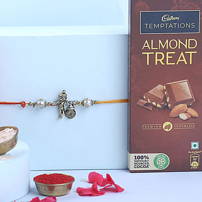 Buy/Send Baby Krishna Rakhi with Cadbury Temptation Online- FNP