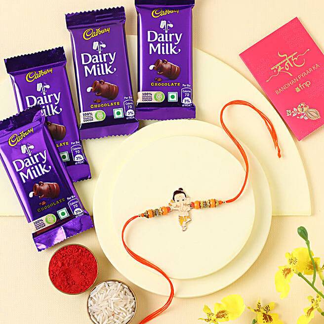 Buy/Send Sneh Bal Ganesha Rakhi for Kids with Cadbury Dairy Milk Online ...