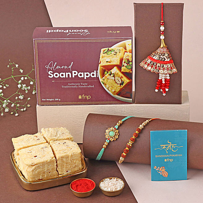 Buy/Send Auspicious Family Rakhi Set & Soan Papdi Box Online- FNP