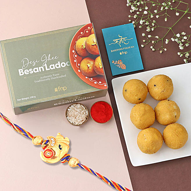 Buy/Send Sneh Bal Ganesha Holy Rakhi & Besan Laddoo Box Online- FNP