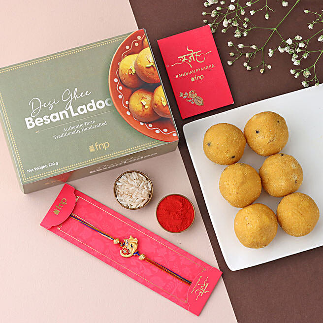 Buy/Send Devotional Ganesha Rakhi & Besan Laddoo Box Online- FNP