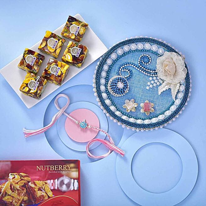 Buy/Send Silver Tortoise Rakhi & Sweet Special Thali Online- FNP