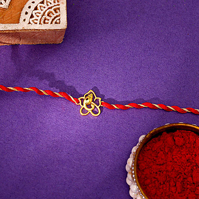 Buy/Send Giva 925 Silver Golden Divine Ganesha Rakhi Online- FNP
