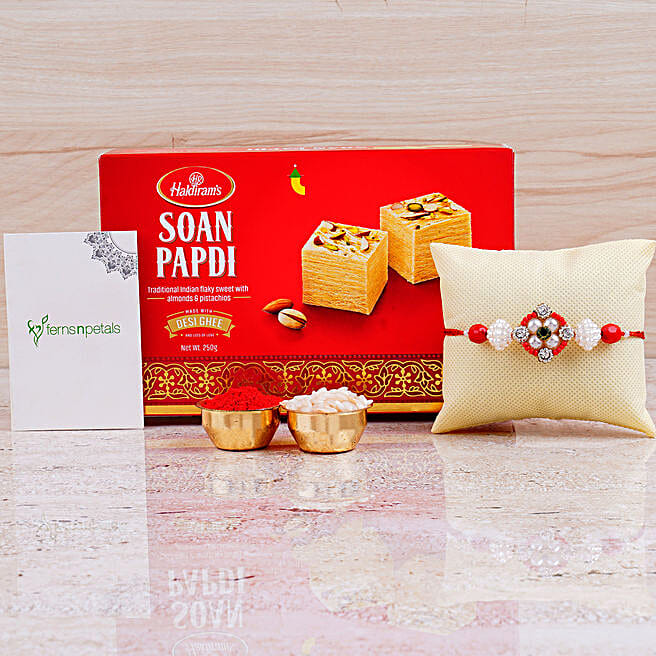 Appealing Floral Rakhi And Box of Soan Papdi portugal | Gift Appealing ...