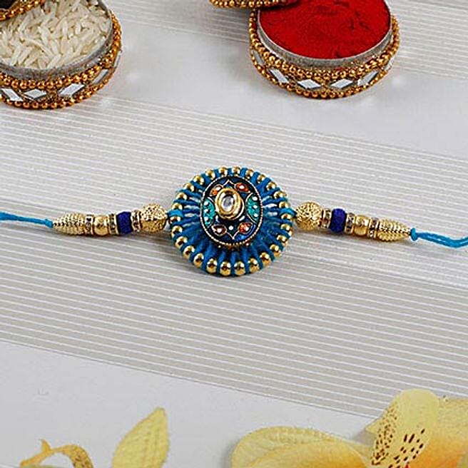 Embellished Blue Rakhi uae | Gift Embellished Blue Rakhi- FNP