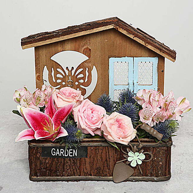Beautiful Flower Arrangement in Hut Shaped Wooden Base uae | Gift ...
