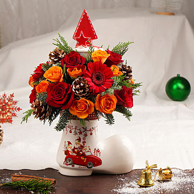 Santa Shoe Flower Arrangement uae | Gift Santa Shoe Flower Arrangement- FNP
