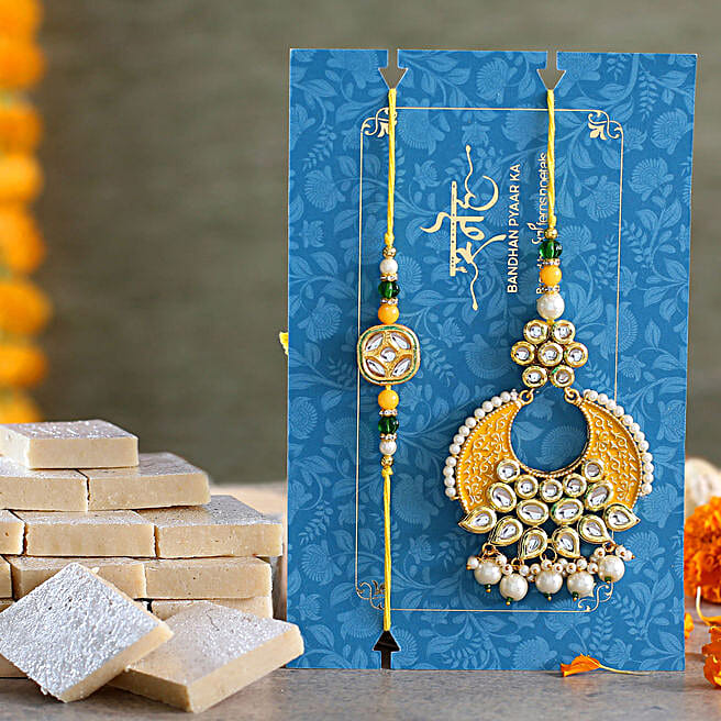 Yellow Crescent Shaped Lumba Rakhi Set With Kaju Katli Exp uk | Gift ...