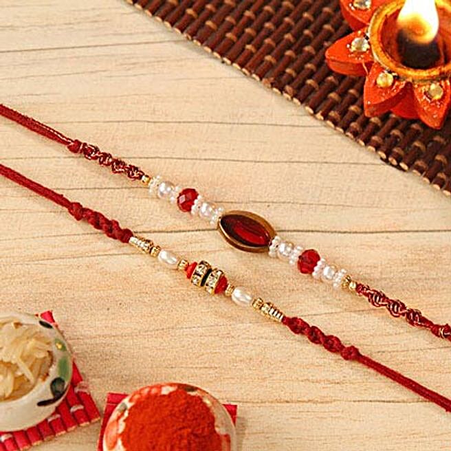 Red Stone Studded Pearl Rakhi Set Of 2 usa | Gift Red Stone Studded ...
