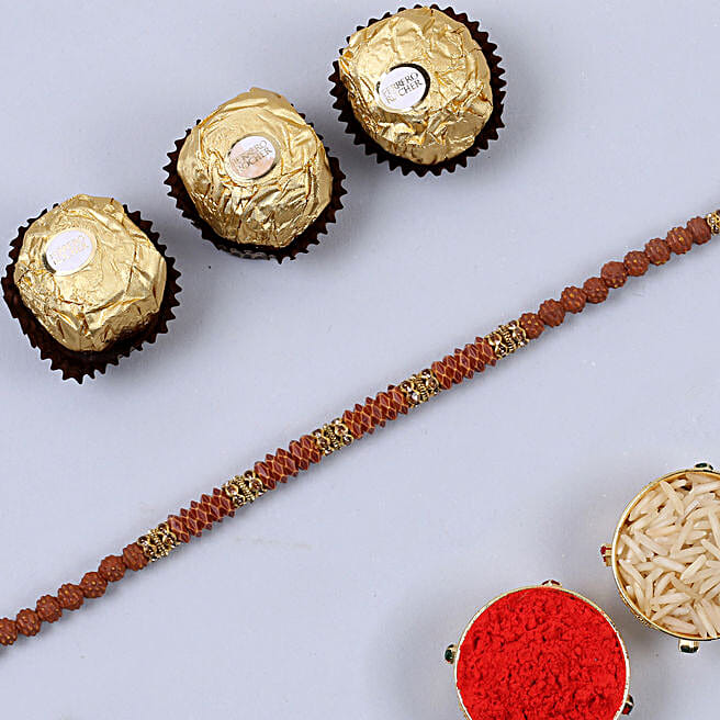 Red Rudraksh Rakhi And 3 Pcs Ferrero Rocher usa | Gift Red Rudraksh ...