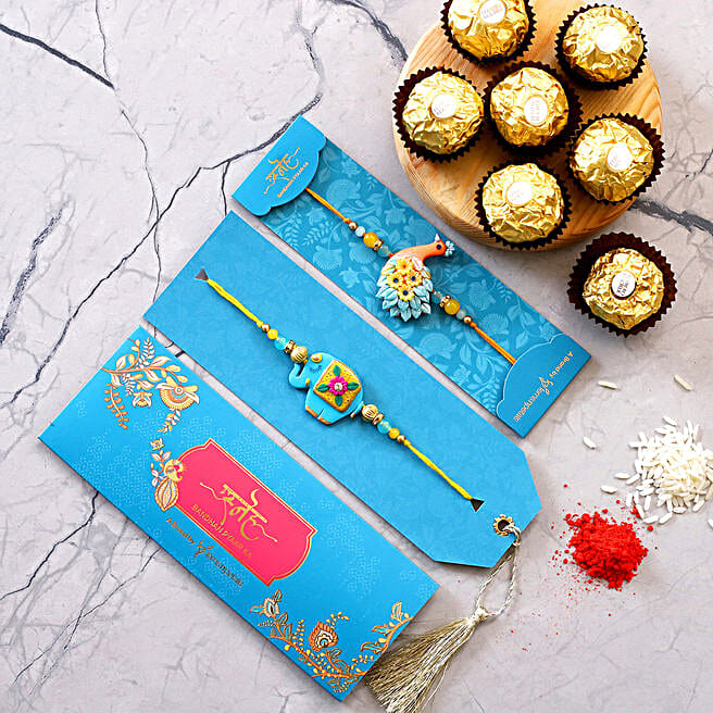 Blue Elephant And Peacock Rakhi Set With 3 Pcs Ferrero Rocher usa ...